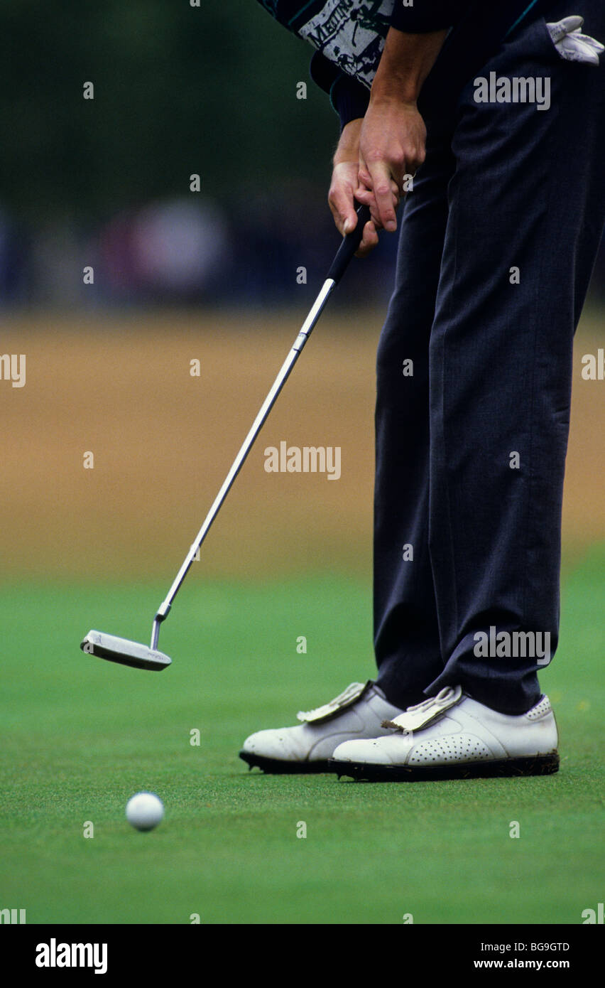 Golfer putting a shot Stock Photo - Alamy