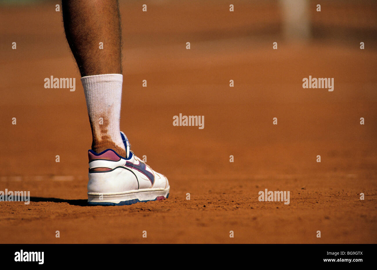 Tennis player on a clay court Stock Photo - Alamy