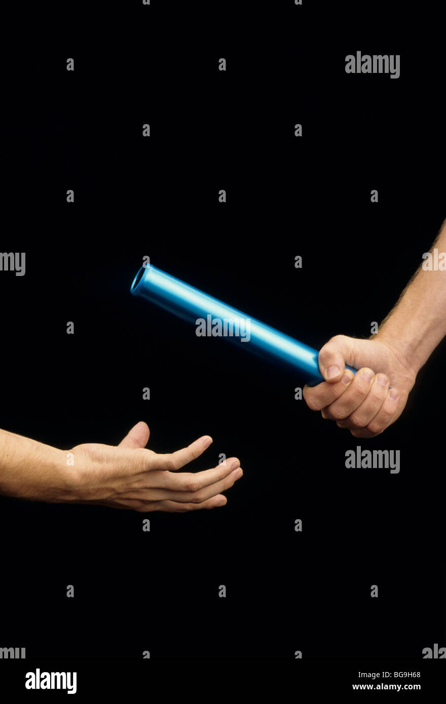 Two athletes passing baton hi-res stock photography and images - Alamy