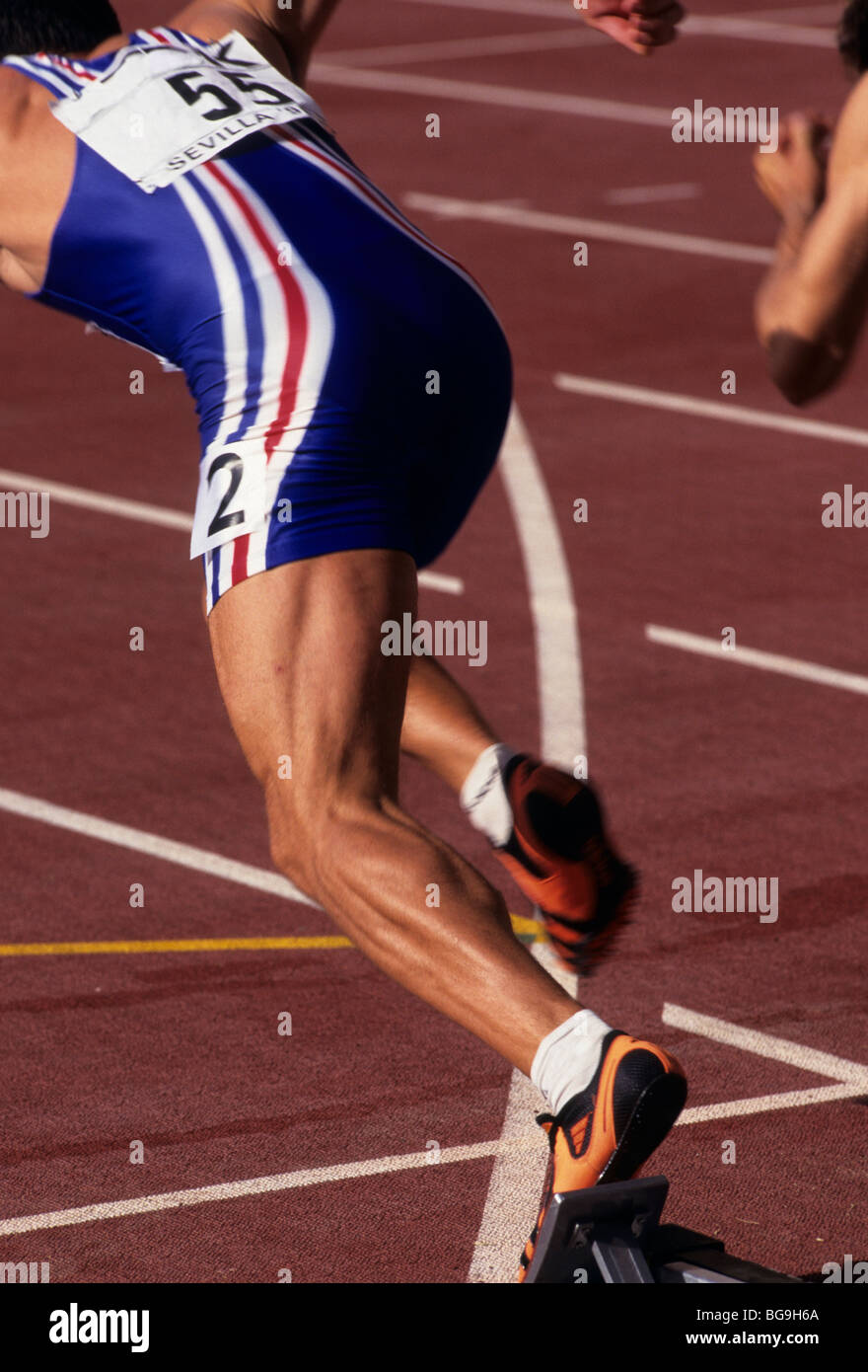 Sprinter leaving the starting block Stock Photo - Alamy