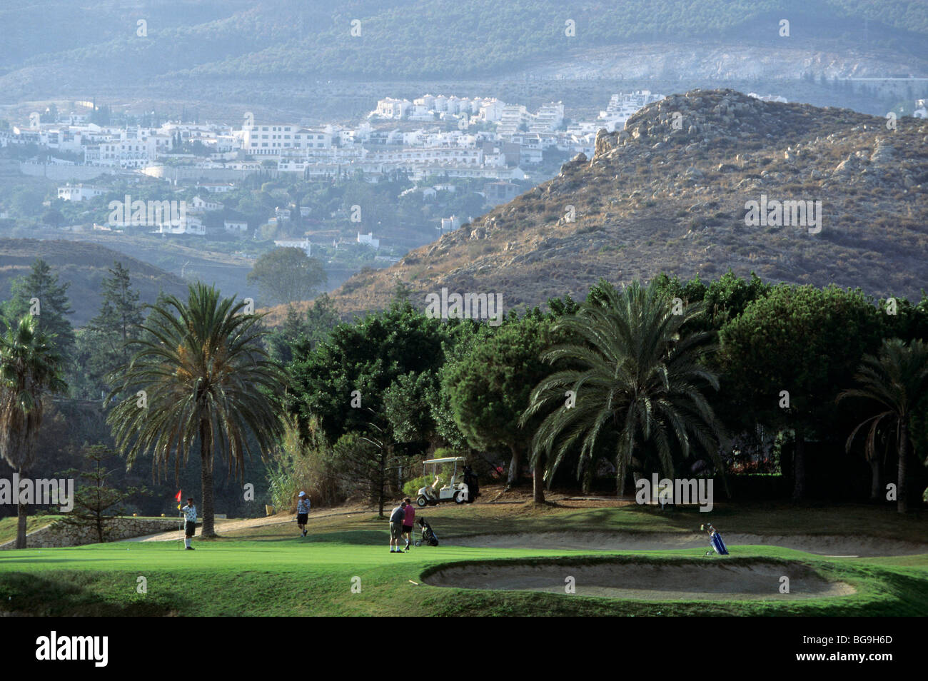 Golfers on a golf course Stock Photo - Alamy