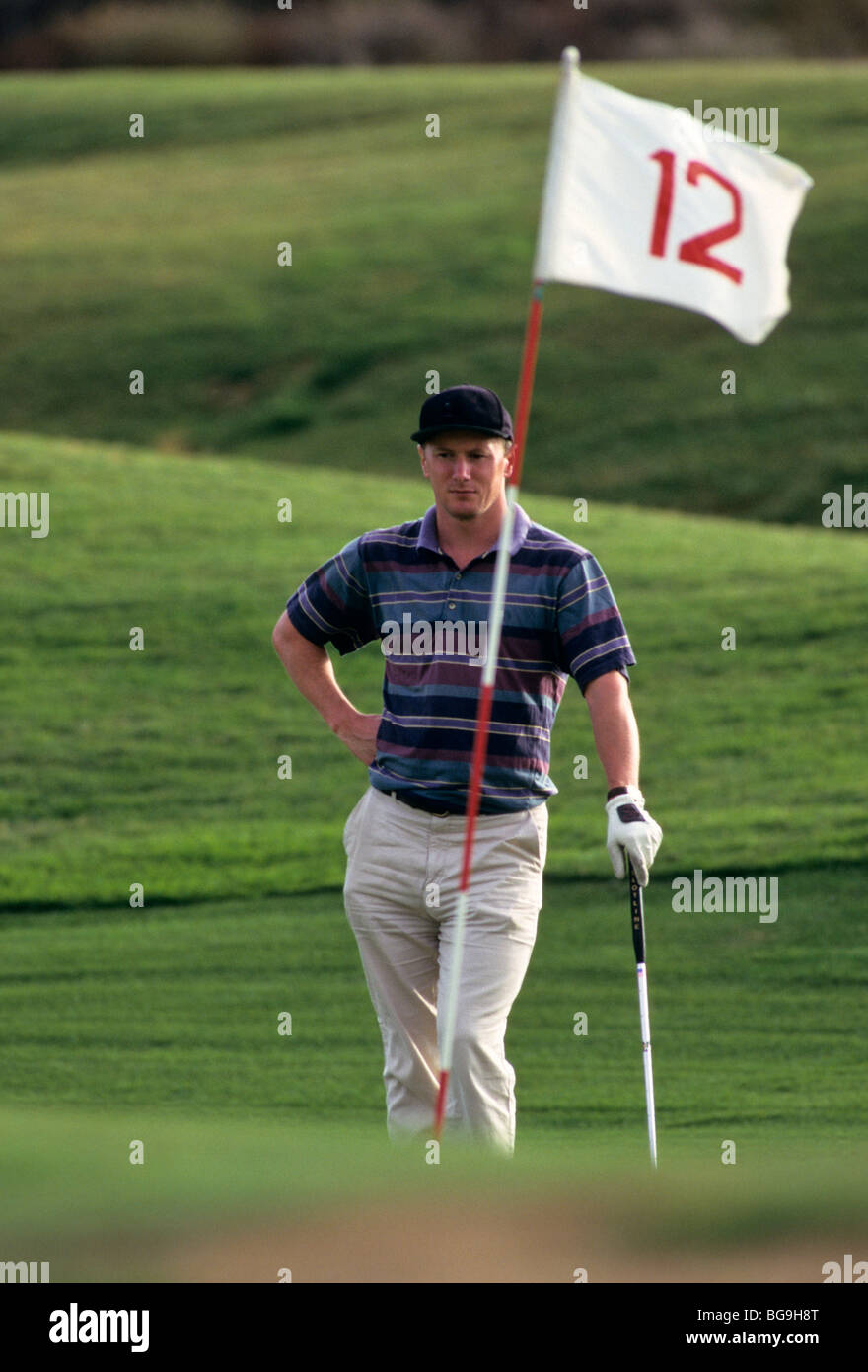 Golfer by the 12th hole Stock Photo - Alamy