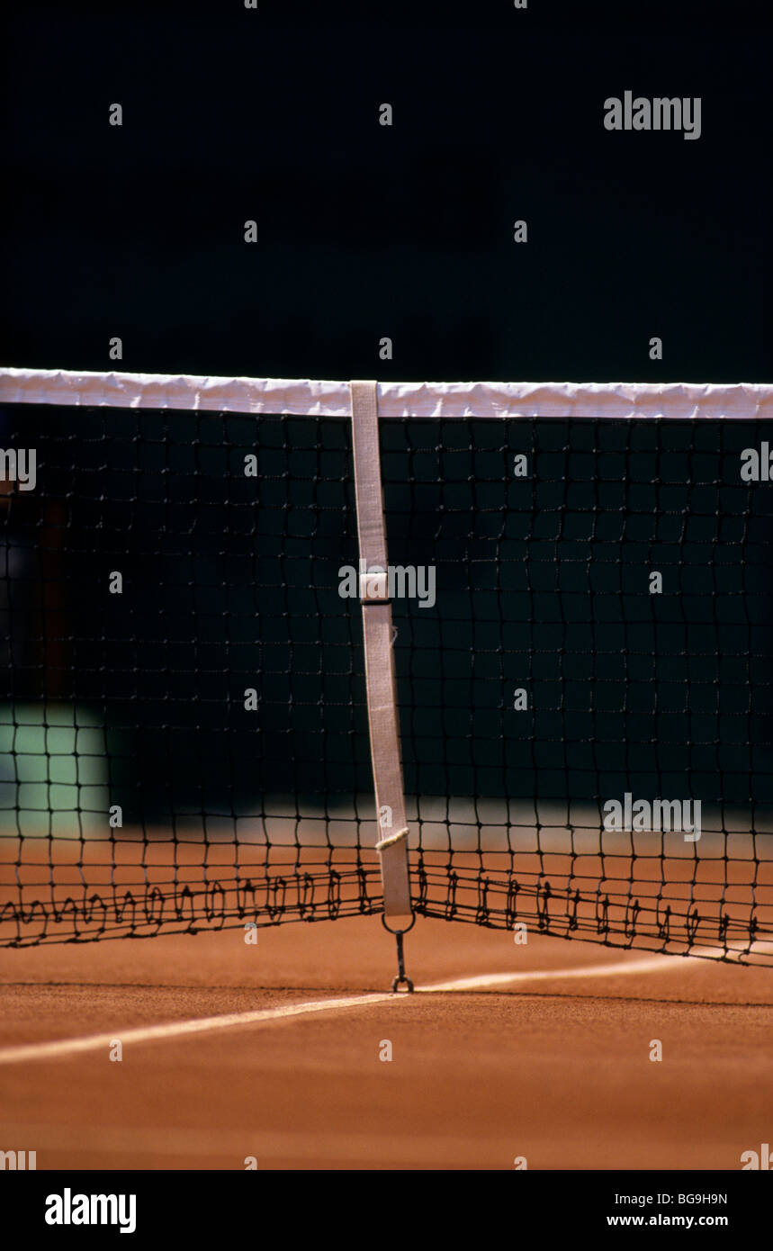 Net on a clay tennis court Stock Photo - Alamy