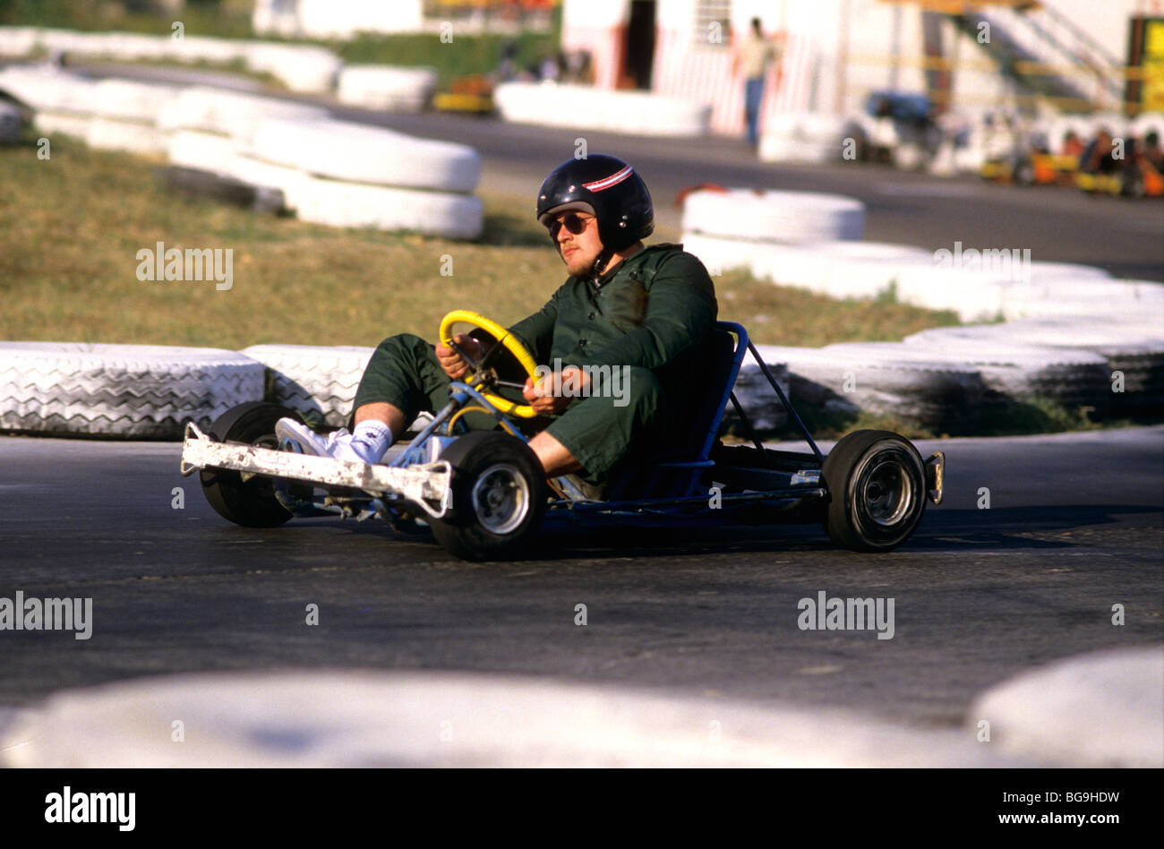 Man driving a go kart around a corner Stock Photo - Alamy