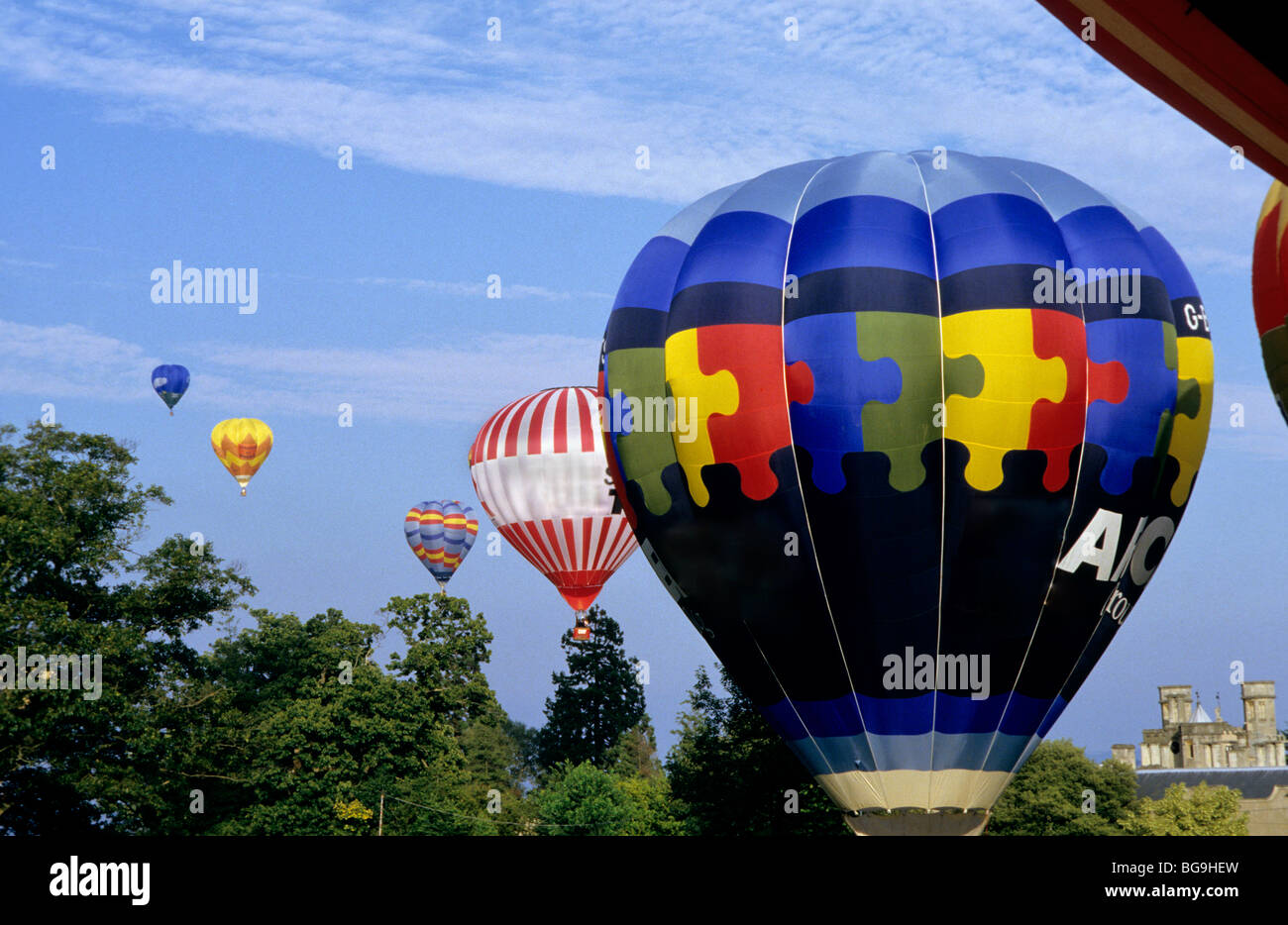 Hot air balloons rising from the ground at a festival Stock Photo - Alamy