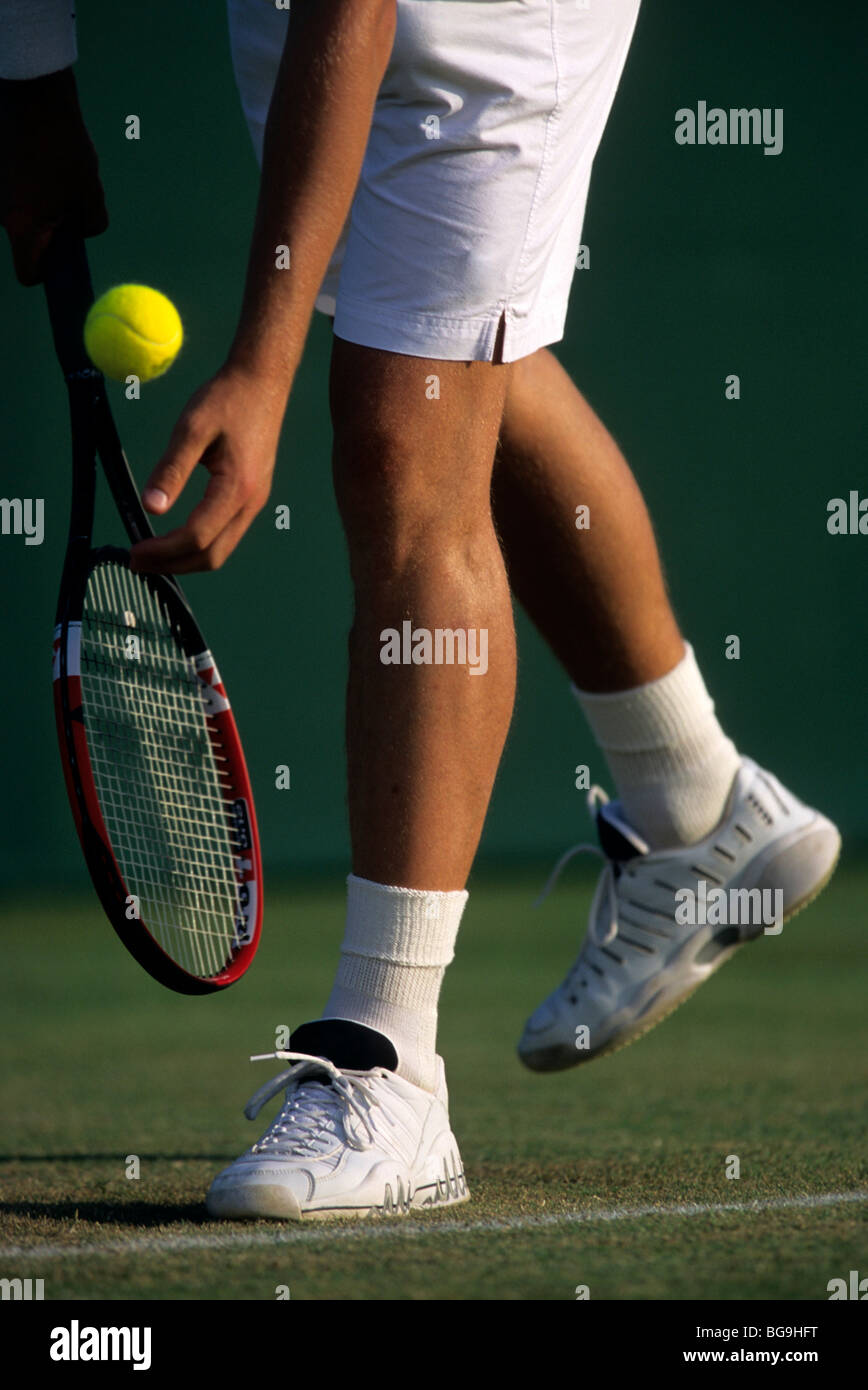 Tennis player preparing to serve Stock Photo - Alamy