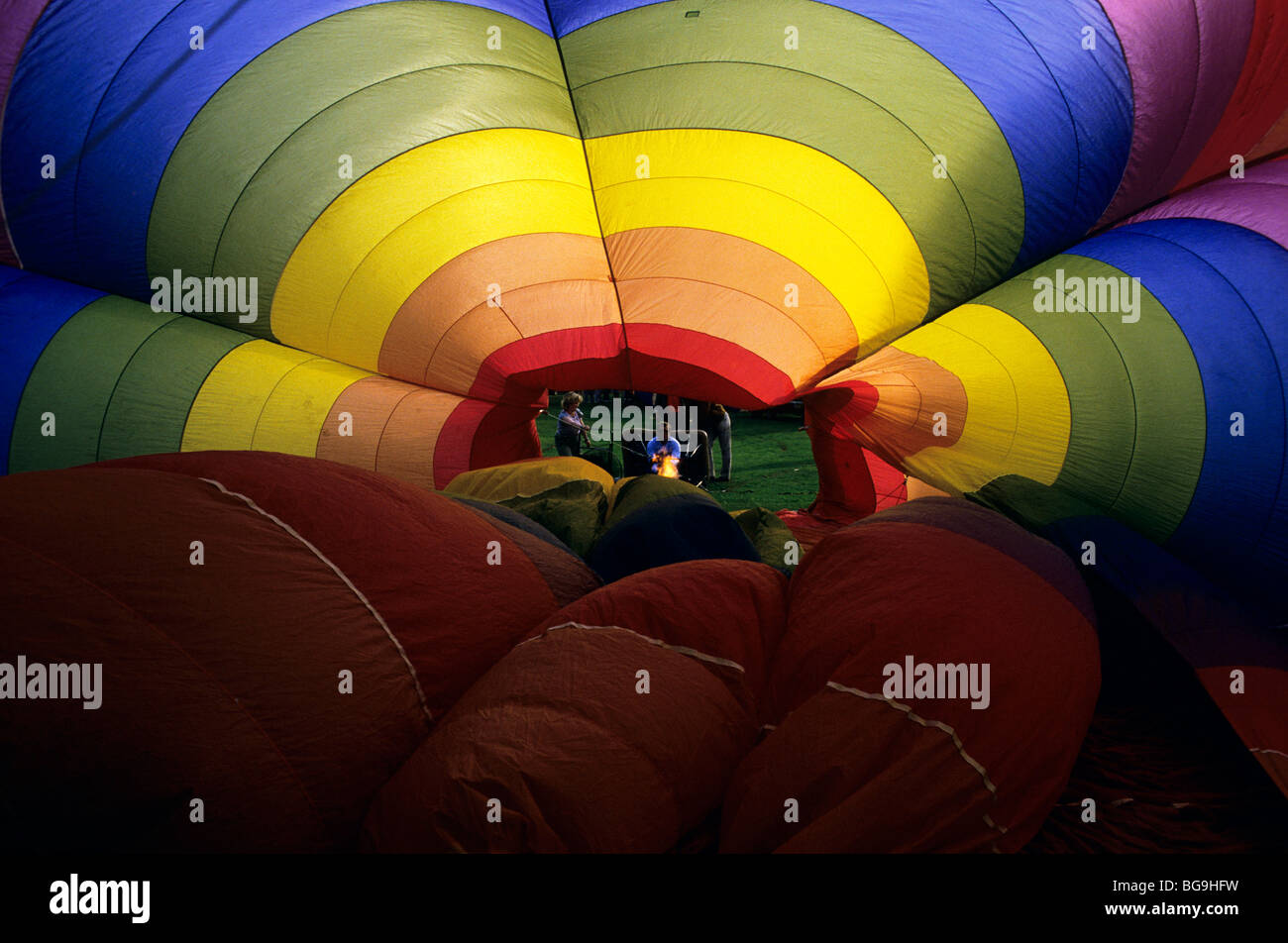 Crew members using a burner to inflate a hot air balloon Stock Photo ...
