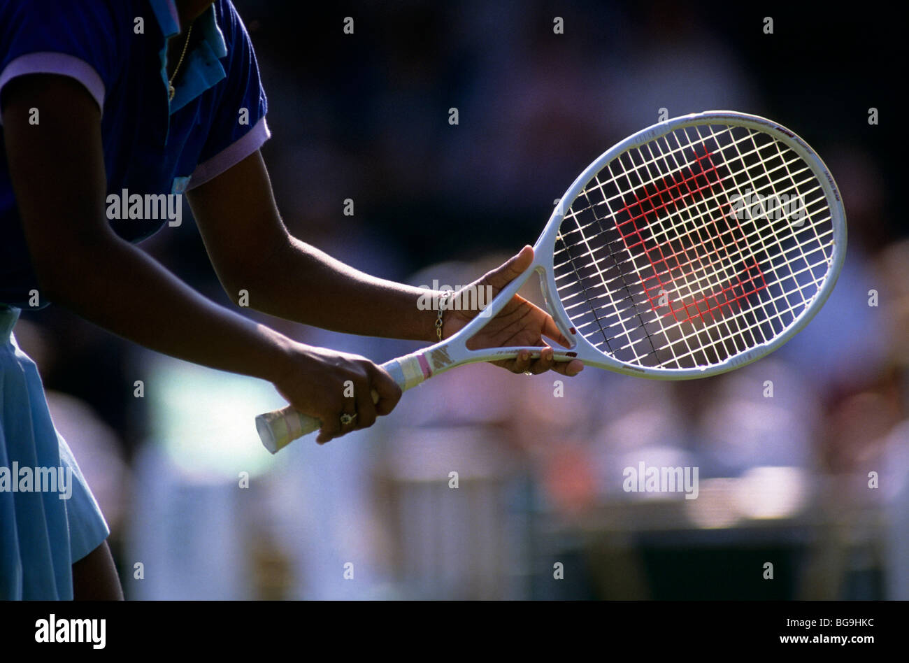 Tennis player holding a tennis racquet Stock Photo - Alamy