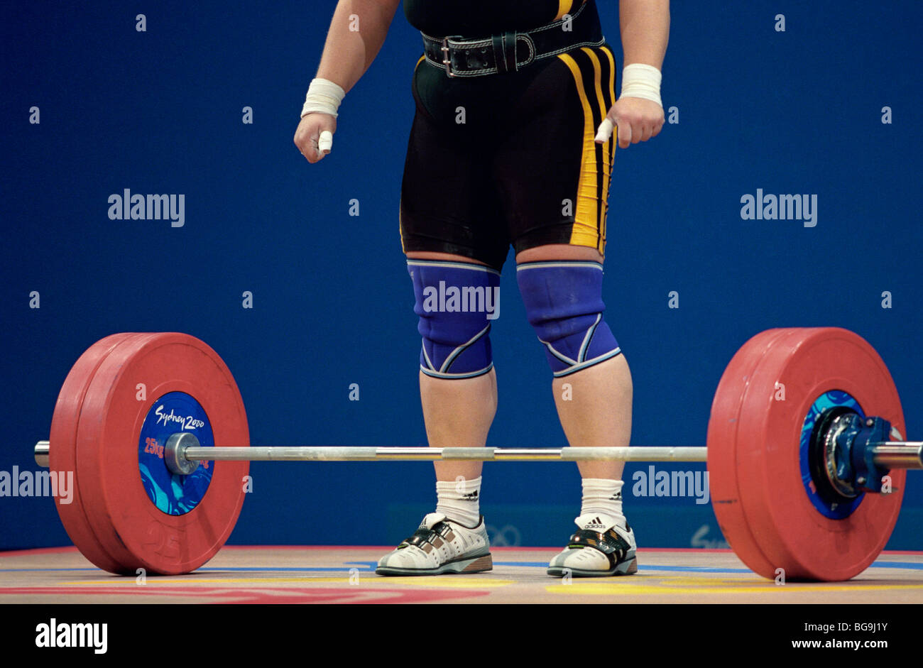Weightlifter prepares to lift a set of weights Stock Photo - Alamy