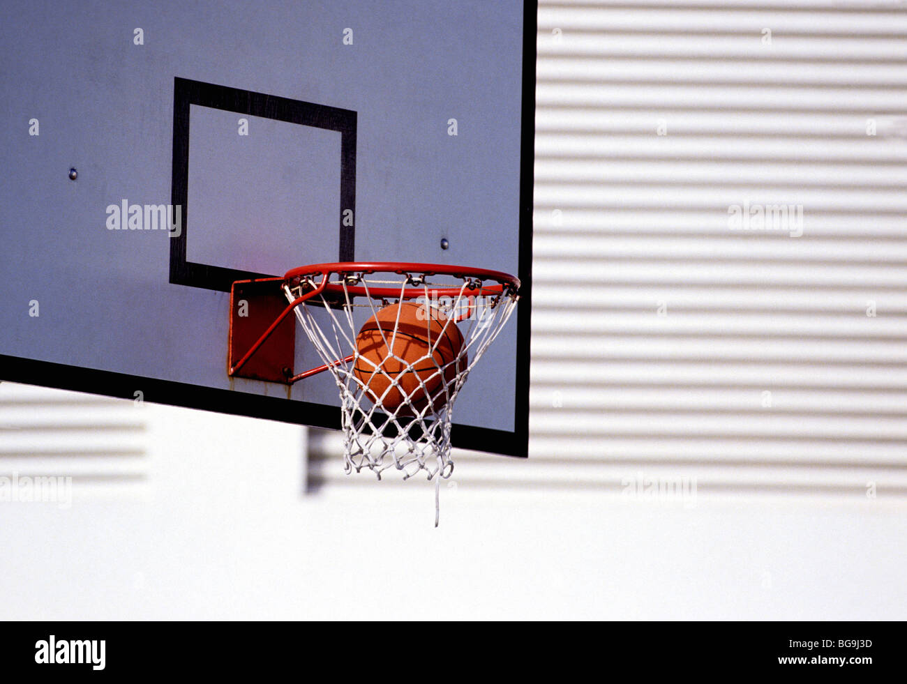 Basketball dropping into the net Stock Photo - Alamy