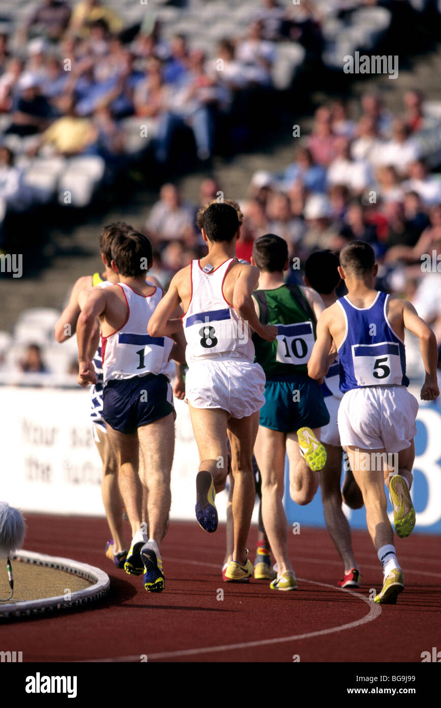 Group of male runners racing on a track Stock Photo - Alamy