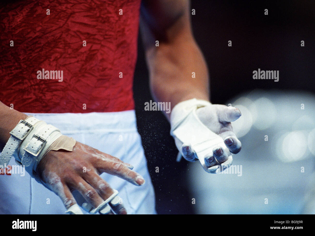 Gymnast wearing bar grips Stock Photo - Alamy