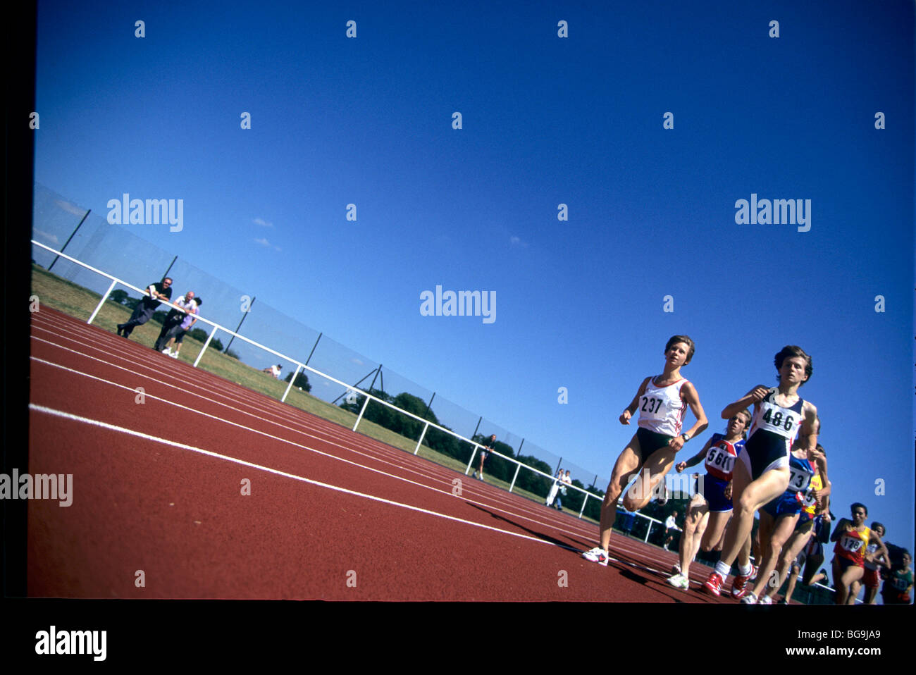 Group of female runners racing on a track Stock Photo - Alamy