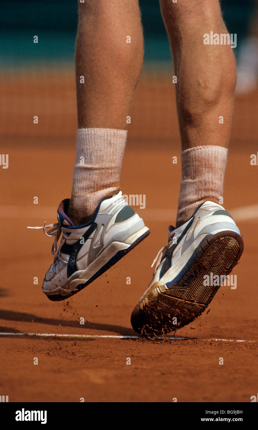 Tennis player on a clay court Stock Photo - Alamy