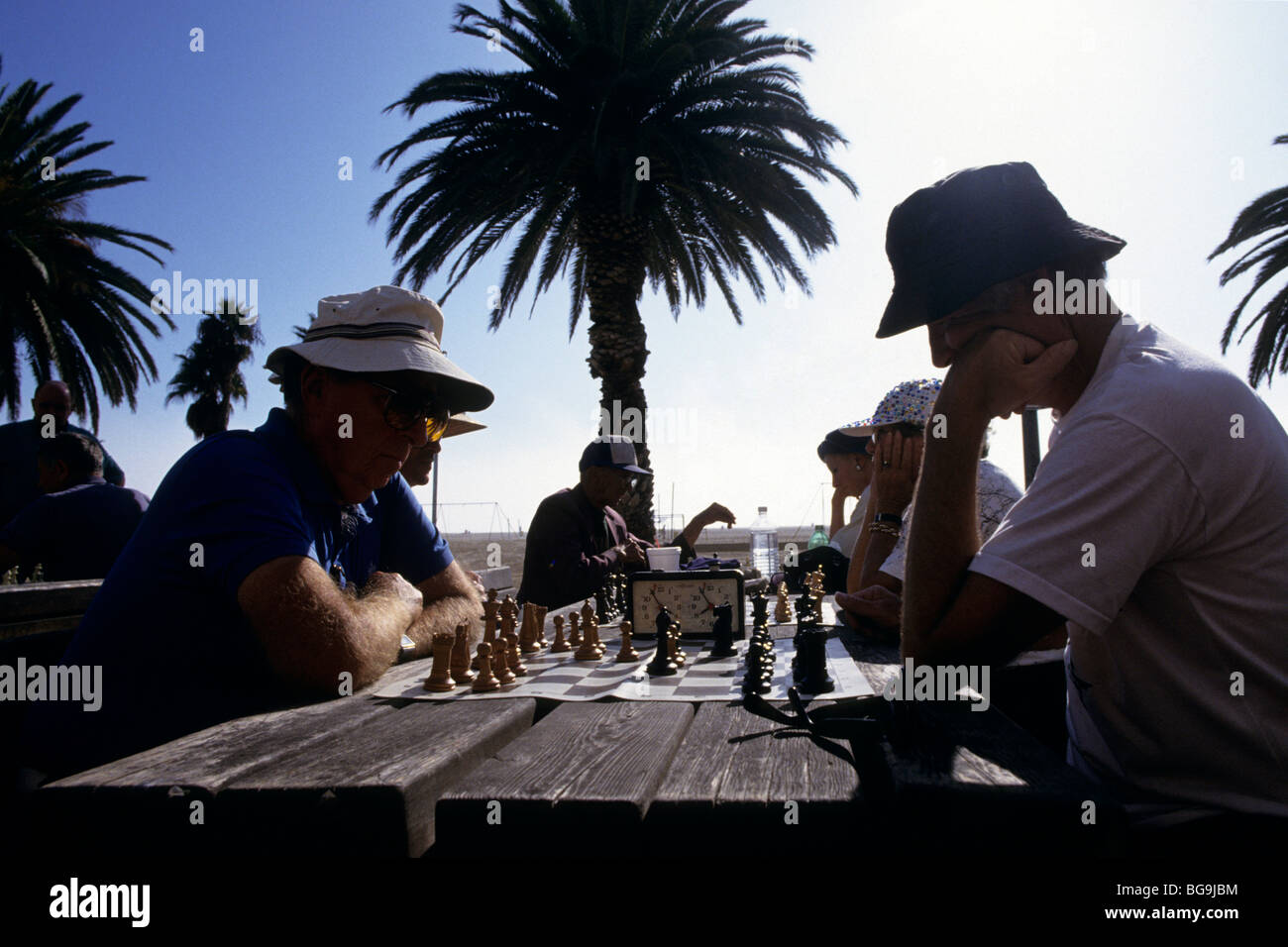 People playing chess by the beach Stock Photo - Alamy