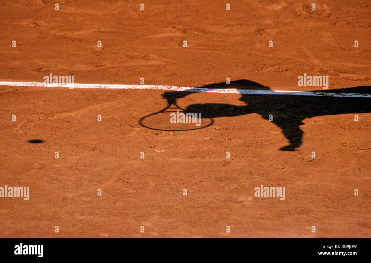 Shadow of a tennis player on a clay court Stock Photo - Alamy