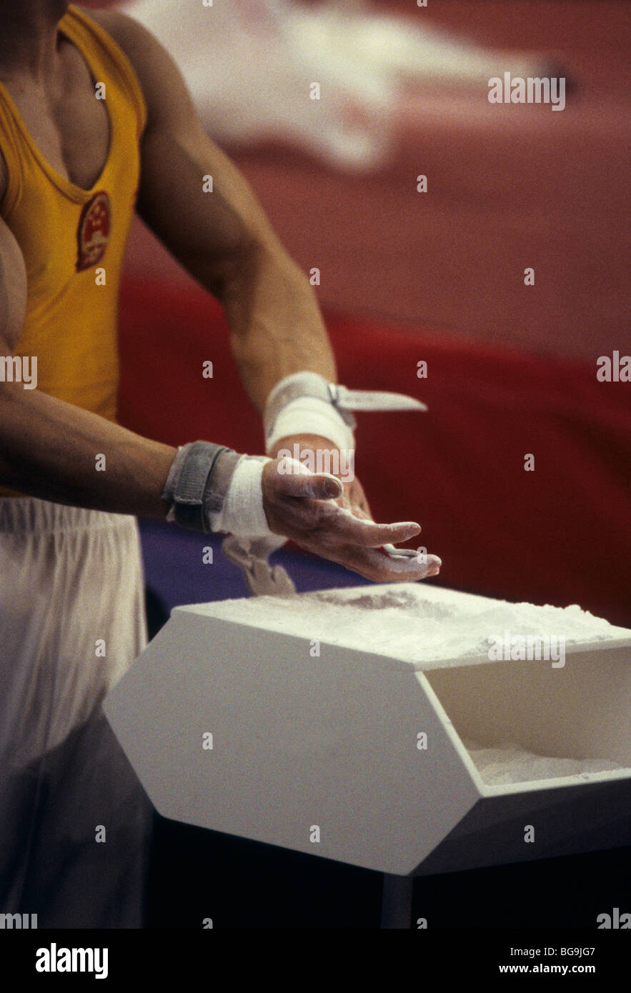 male gymnast chalking hands Stock Photo - Alamy