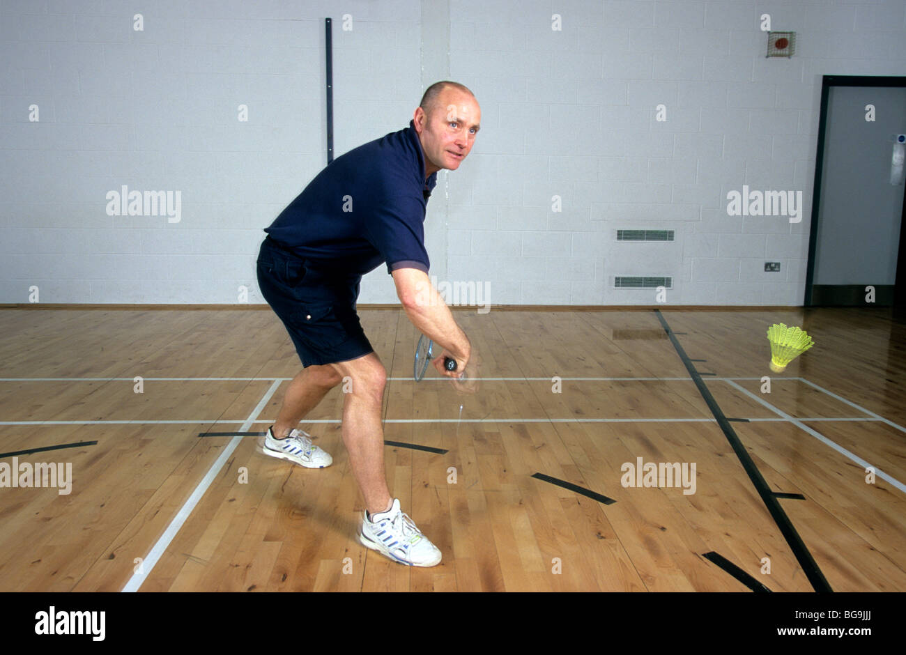 Man playing badminton Stock Photo - Alamy