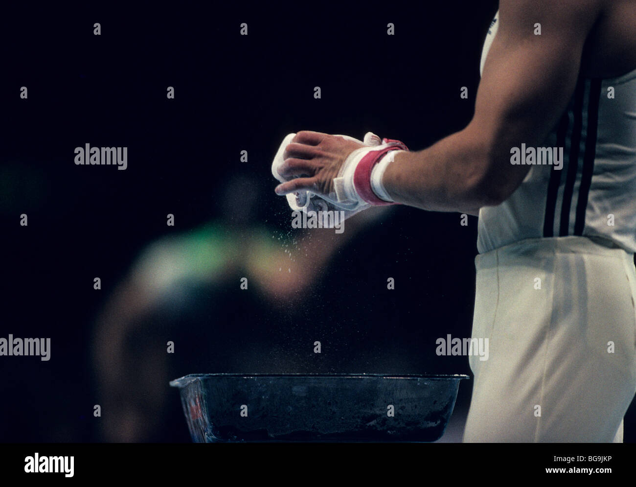 Male gymnast chalking hands hi-res stock photography and images - Alamy