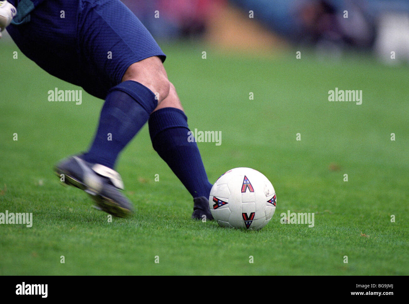 Football player about to kick a ball Stock Photo - Alamy