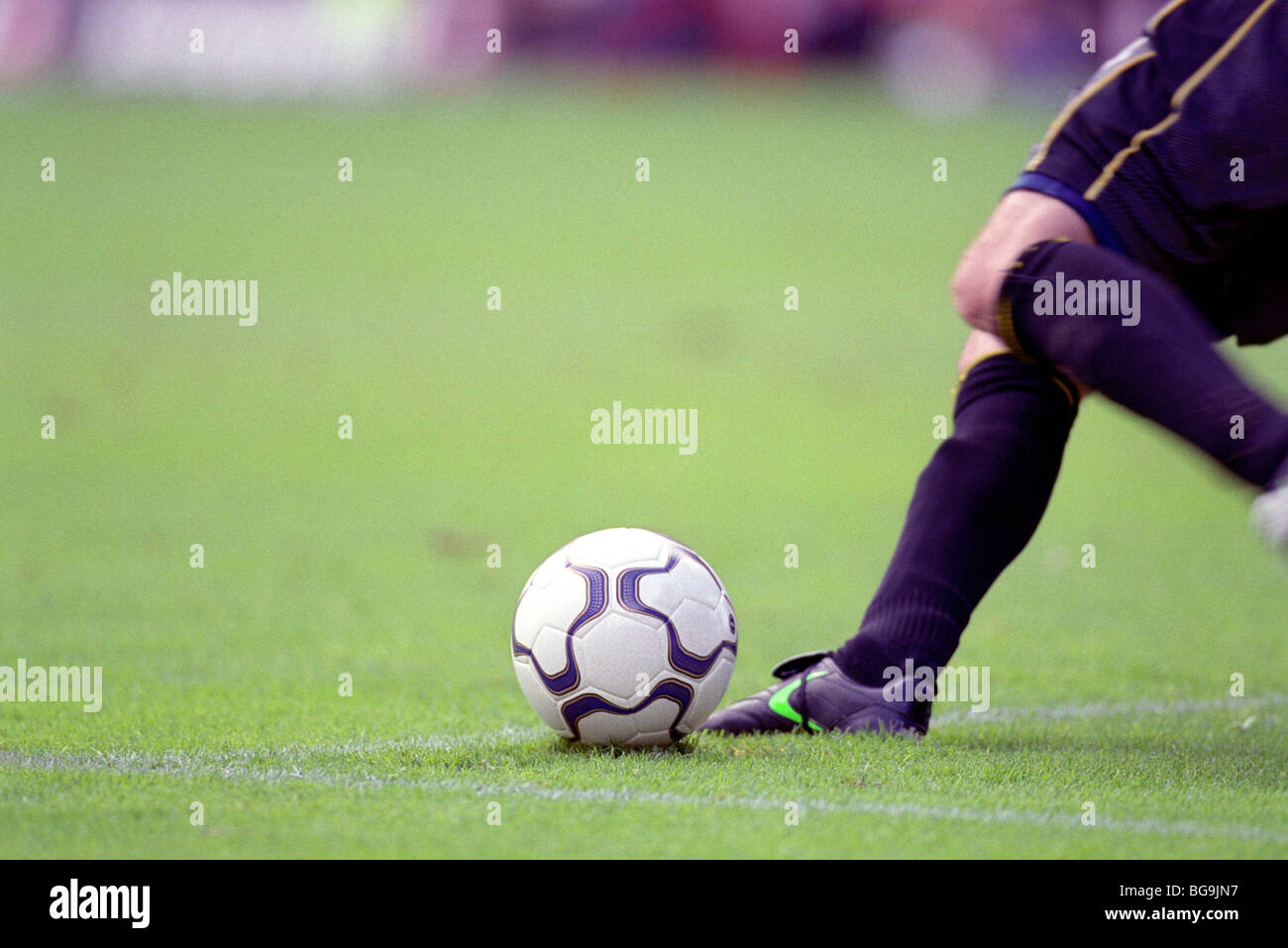 Football player about to kick a ball Stock Photo - Alamy