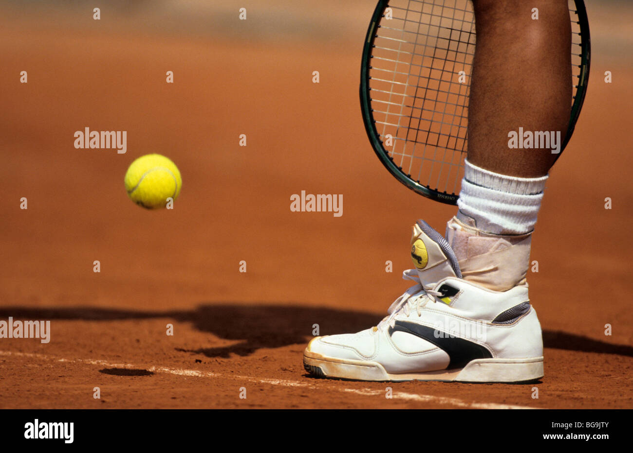 Tennis player on a clay court Stock Photo - Alamy