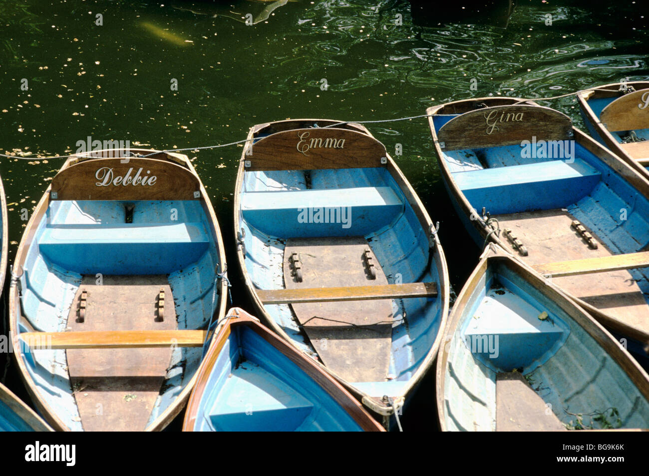 Group of rowing boats by side of river Stock Photo - Alamy