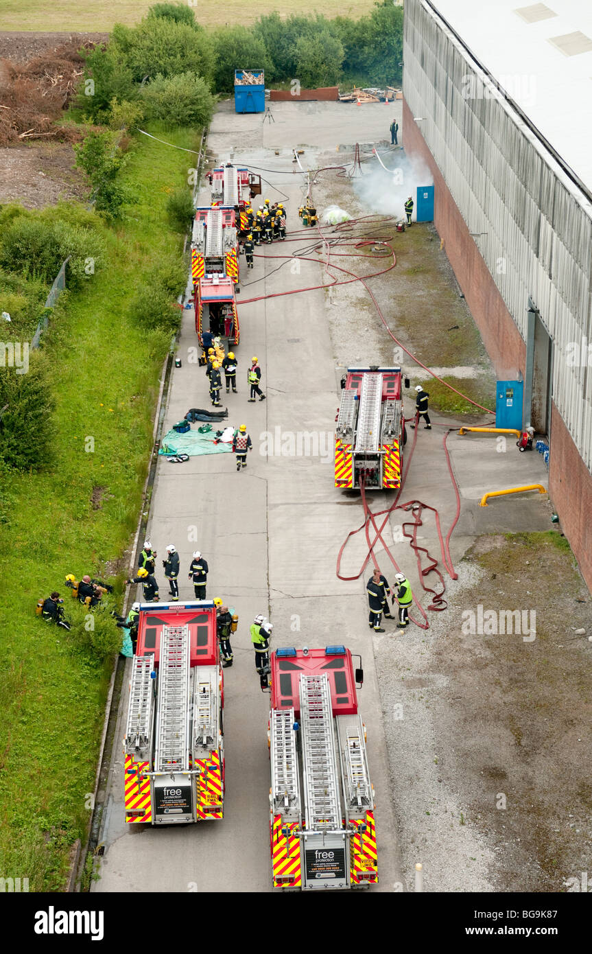 Many fire engines outside large factory fire from above Stock Photo - Alamy