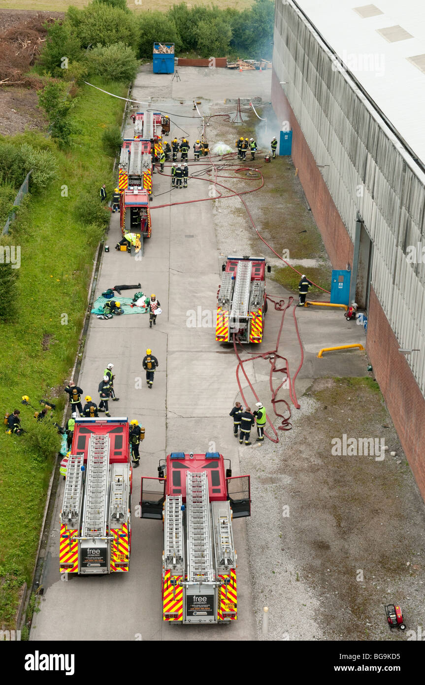 Many fire engines outside large factory fire from above Stock Photo - Alamy