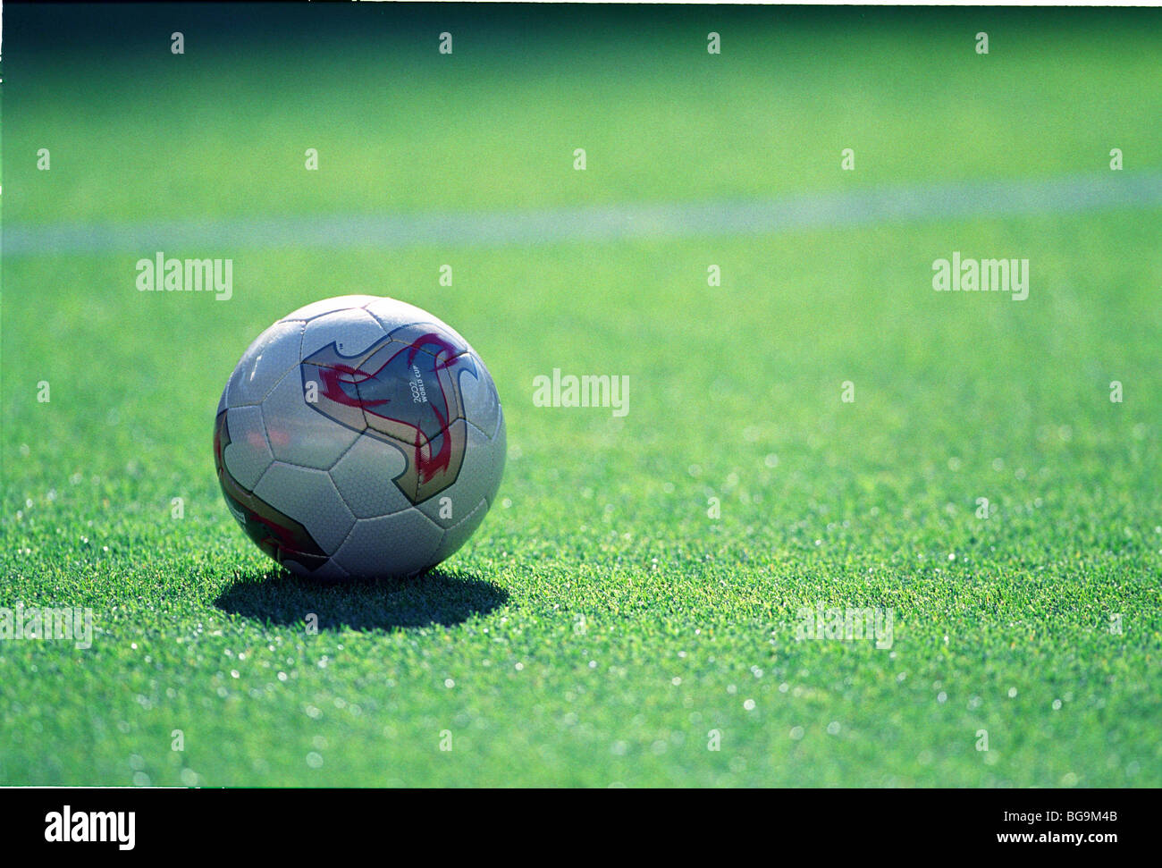 Football on a pitch Stock Photo - Alamy
