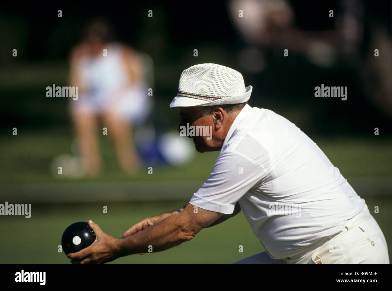 Man preparing to throw a wood Stock Photo - Alamy