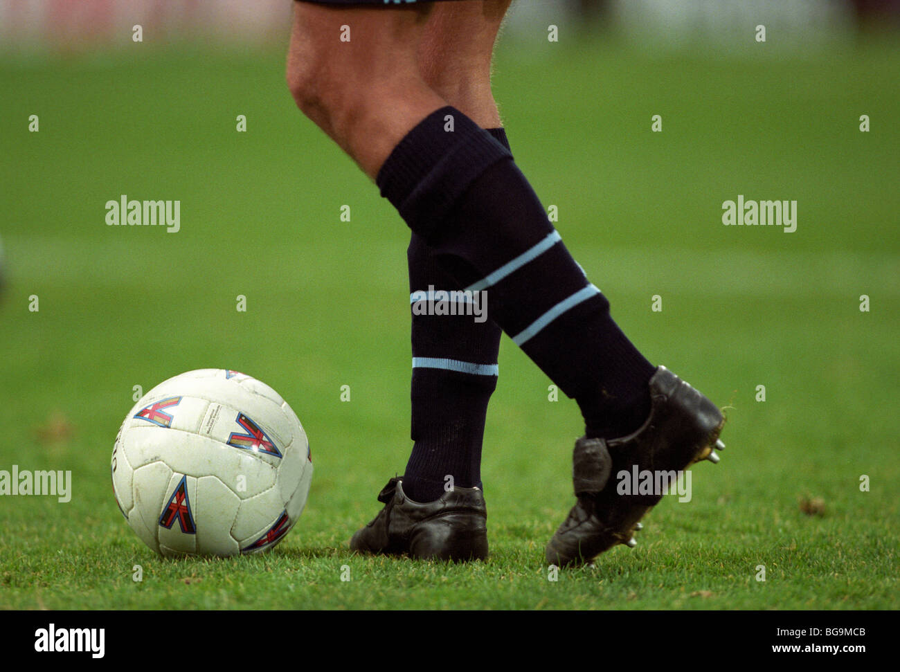 Football player about to kick the ball Stock Photo - Alamy