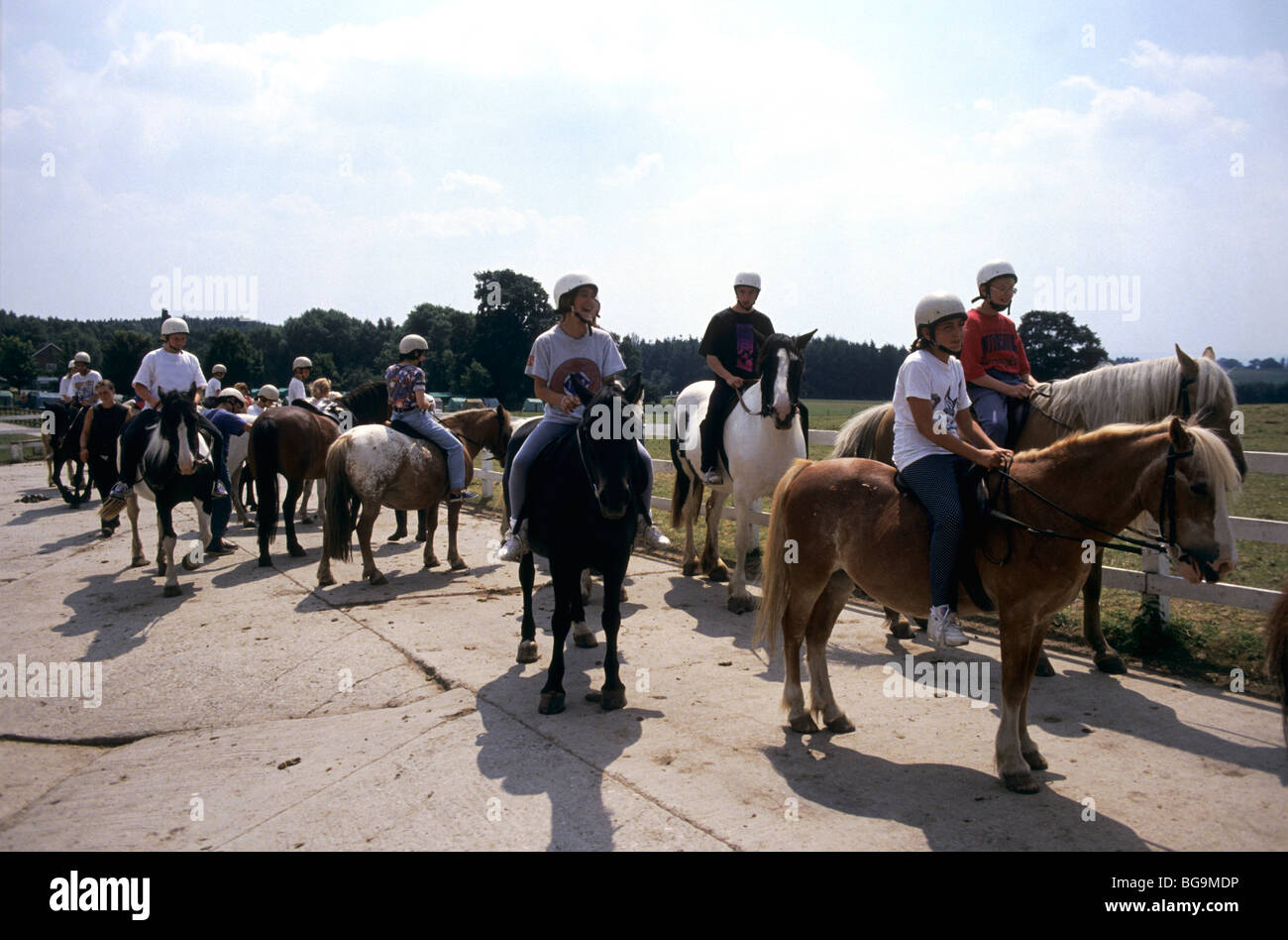 Group of horse riders on a trail Stock Photo - Alamy
