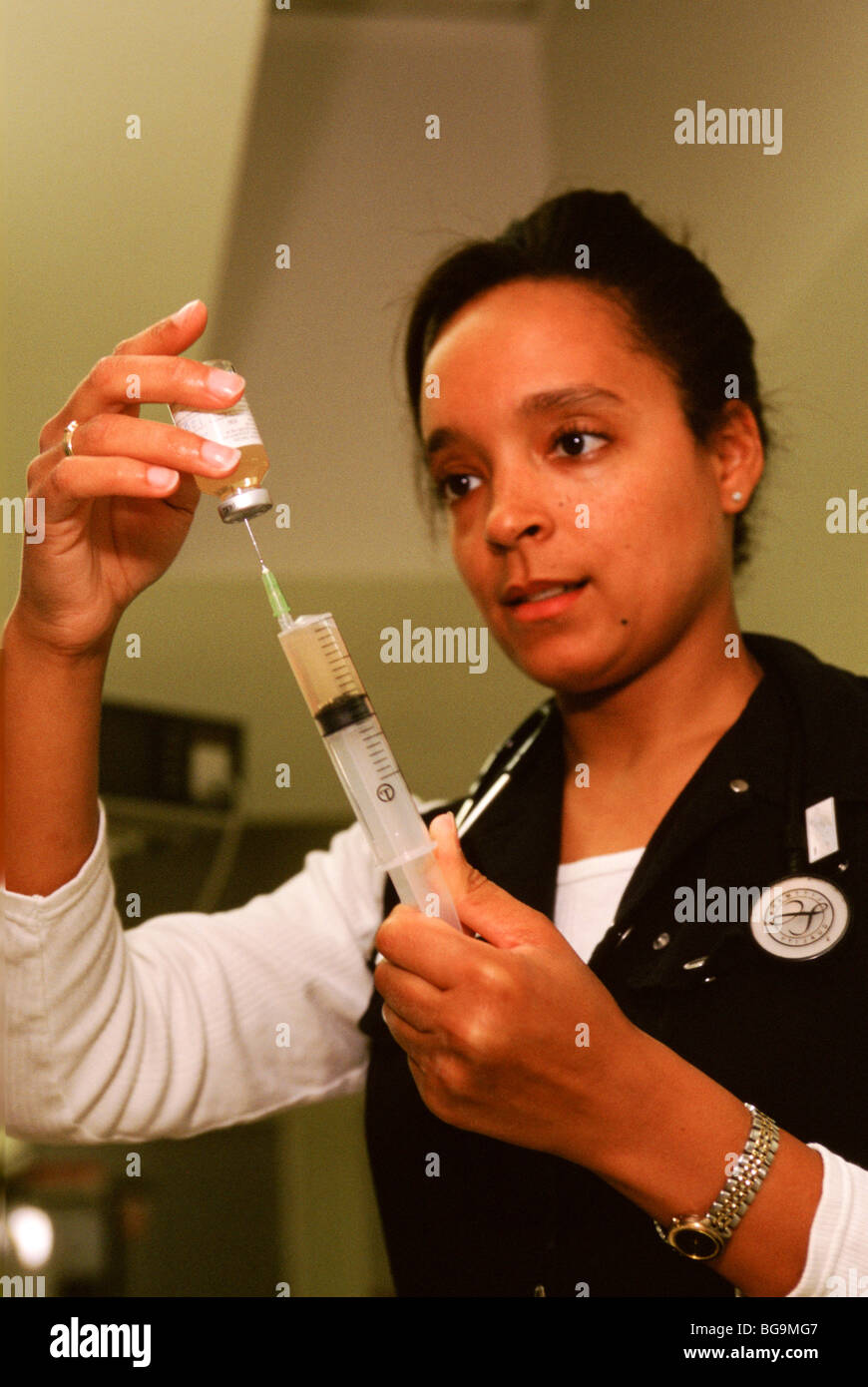 A doctor prepares to give an injection in A&E at an NHS hospital ...