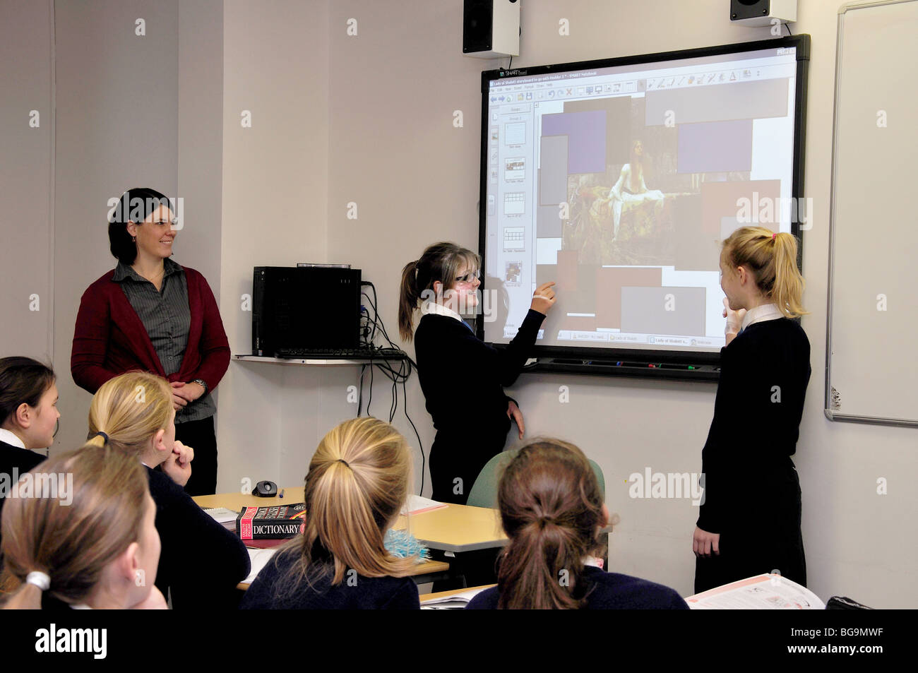 Female teacher teaching girls in classroom, Heathfield St Mary's School ...