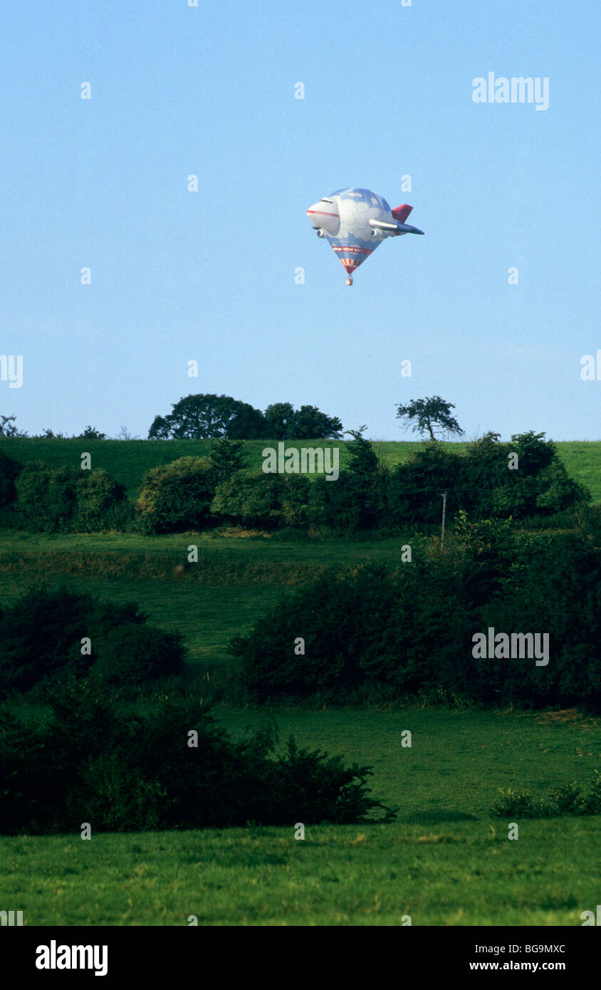 Plane shaped hot air balloon in flight Stock Photo - Alamy