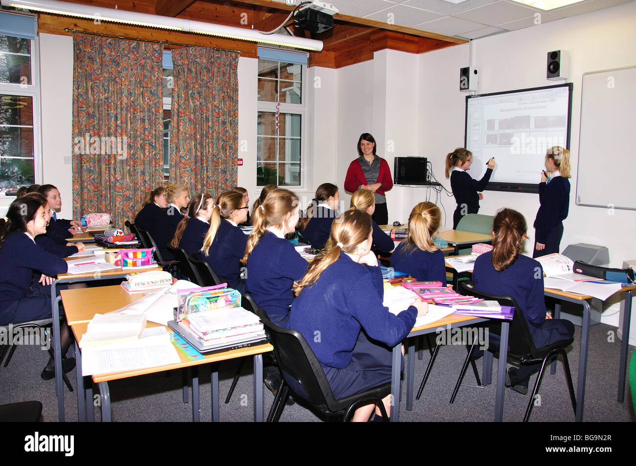 Female teacher teaching girls in classroom, Heathfield St.Mary's Stock ...