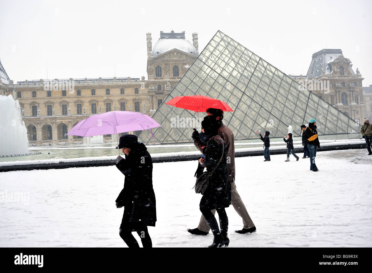 Paris, France, People Walking Winter Snow Storm, Pyramid at the Louvre ...