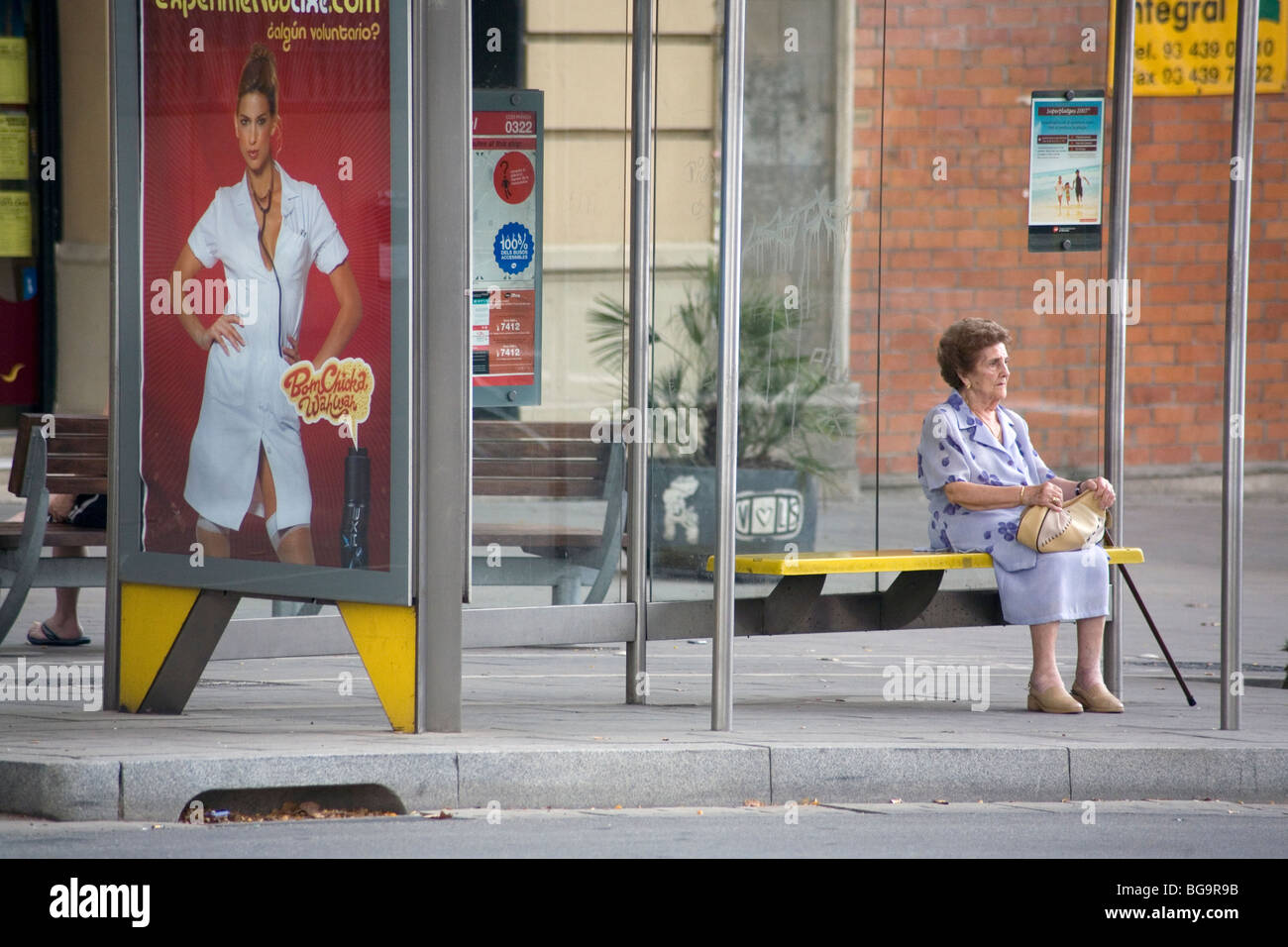 Elderly woman sitting bus stop hi-res stock photography and images - Alamy
