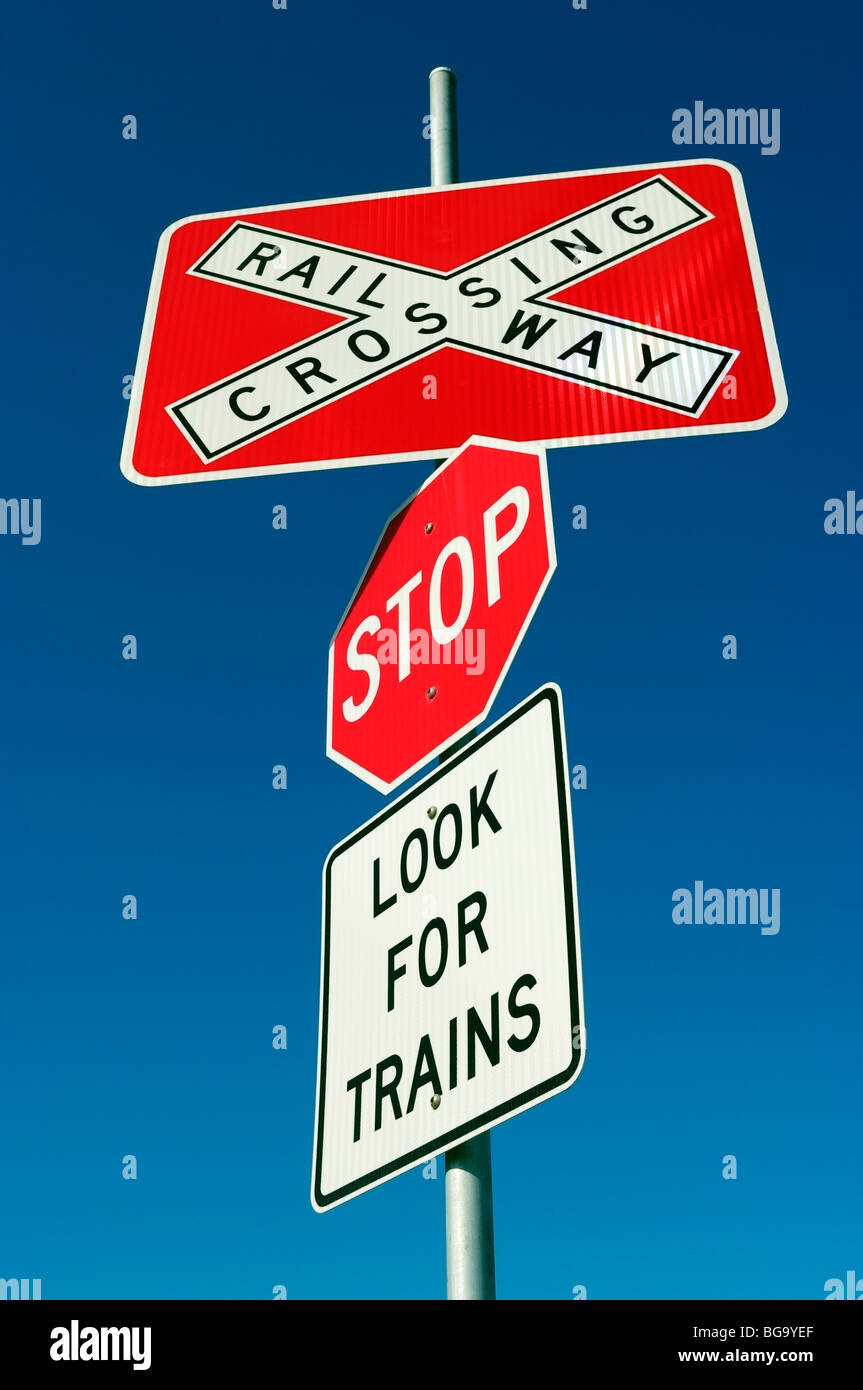 Railway crossing warning sign Stock Photo - Alamy