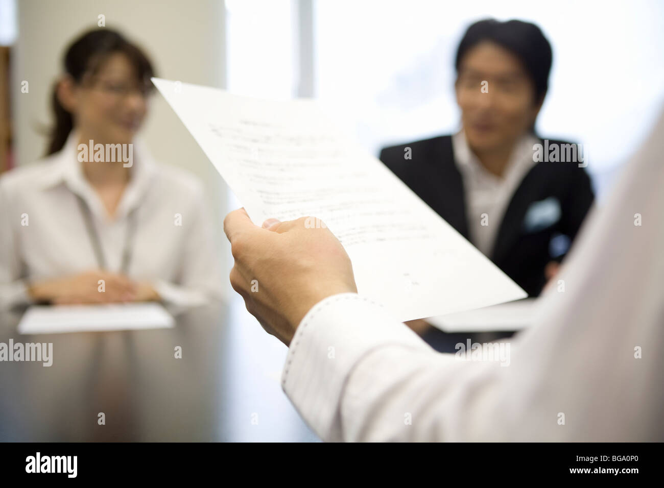 Human hand holding document Stock Photo - Alamy