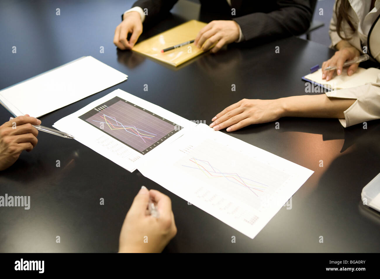 People's hands on meeting table Stock Photo - Alamy