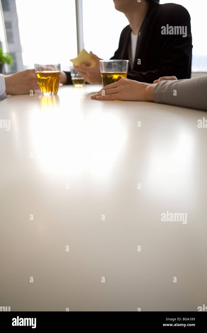 Human hand on meeting table Stock Photo - Alamy