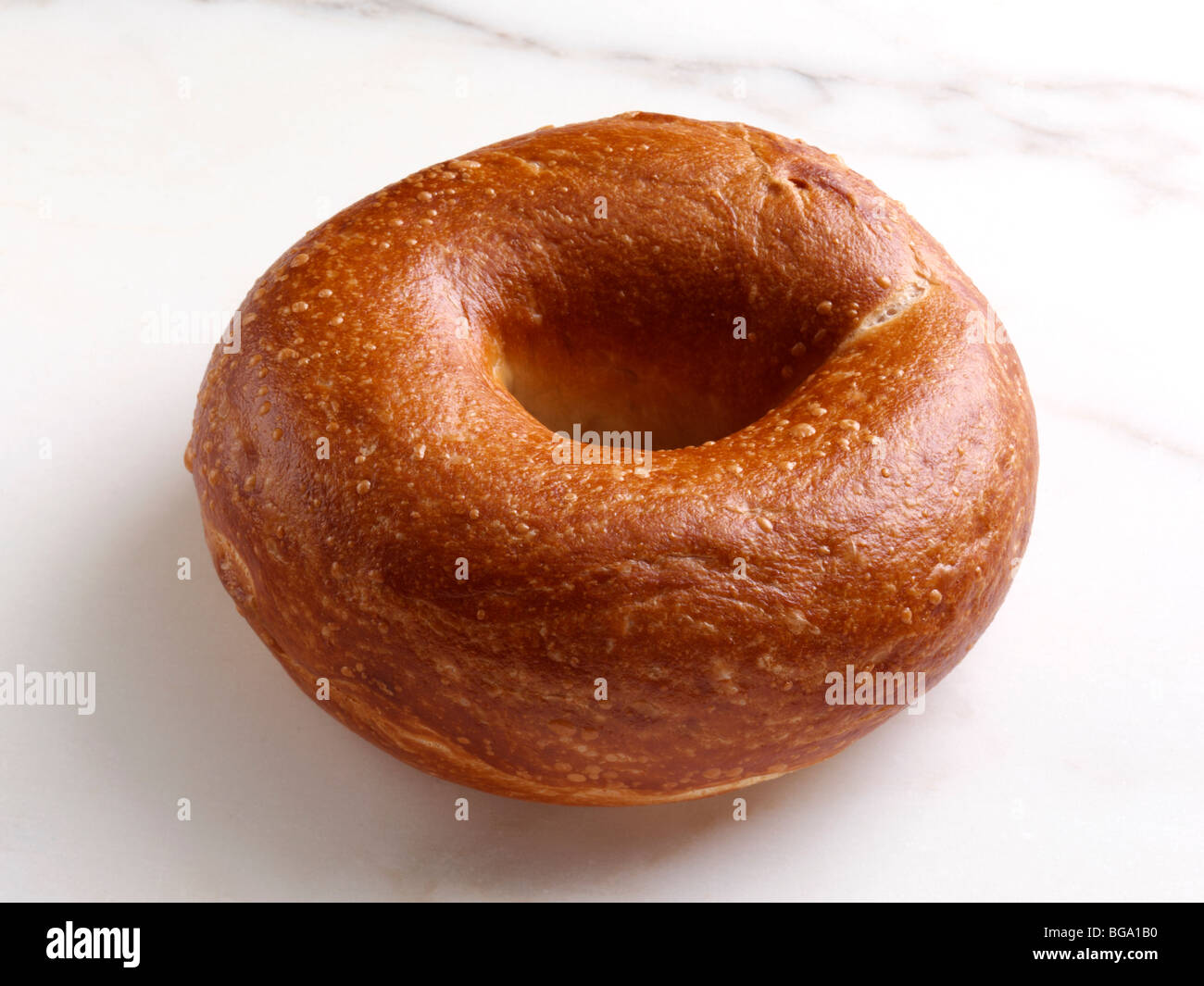 A bagel on a white background Stock Photo - Alamy