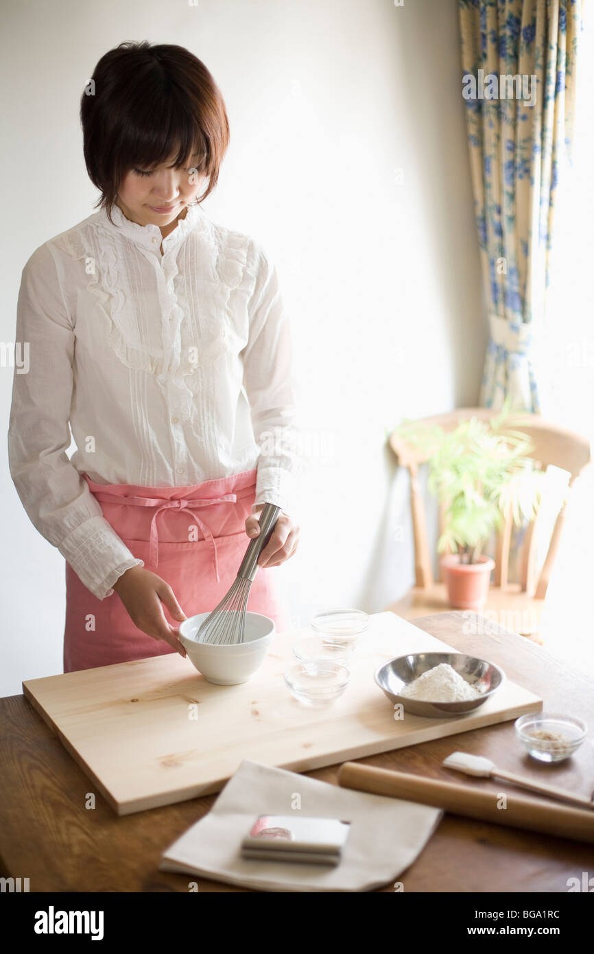 Young woman making bread Stock Photo - Alamy