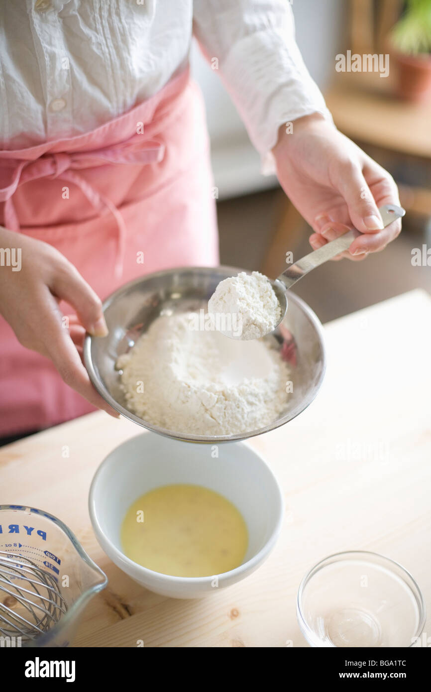 Human hand of young woman cooking bread Stock Photo - Alamy