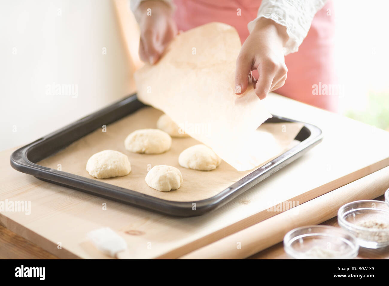 Human hand of young woman baking bread Stock Photo - Alamy