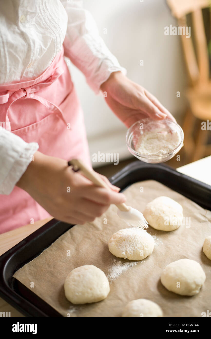 Human hand of young woman baking bread Stock Photo - Alamy