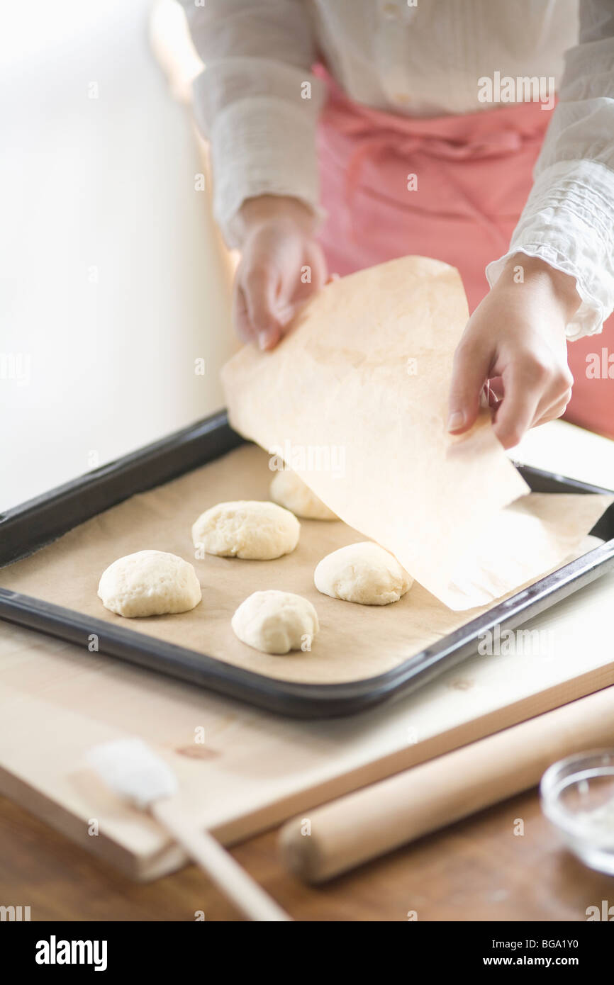 Human hand of young woman baking bread Stock Photo - Alamy
