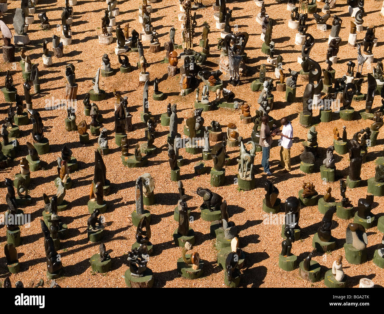 Customers in a fields of carved statues Stock Photo - Alamy